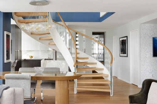modern floating curved staircase with glass railings
